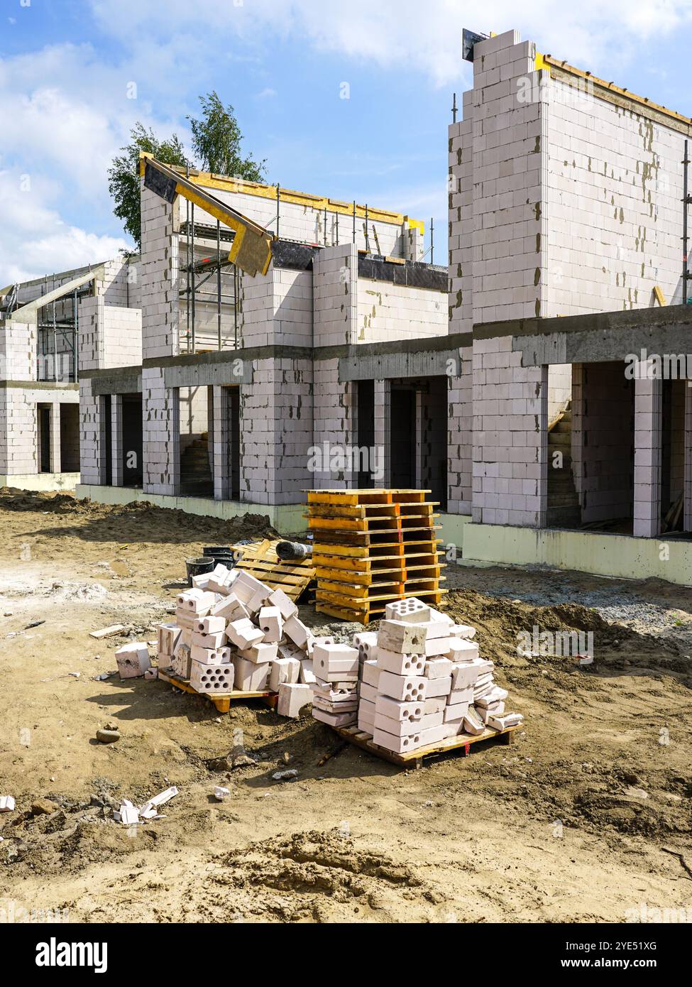 Construction site of a new residential terraced house from expanded ...