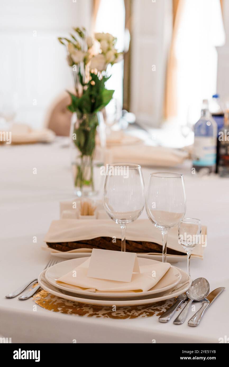 Elegant Table Setting with Floral Centerpiece and Fine Dining Utensils ...