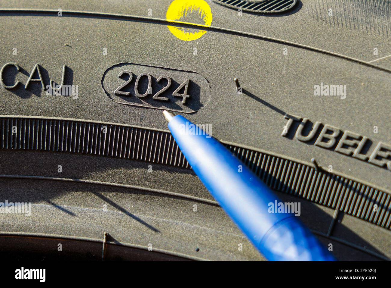 Side view of tire with designation that specify of week and year of ...