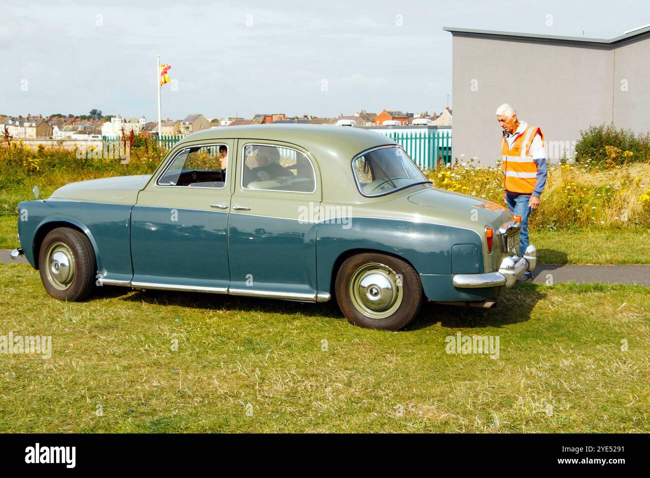 Vintage two-tone Rover 100 P4 car on display at an outdoor car show ...