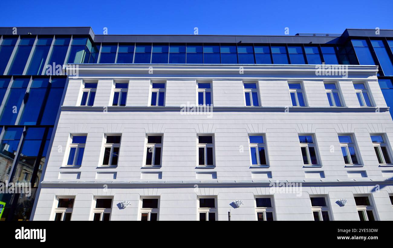 A renovation residential building and an adjacent modern office ...