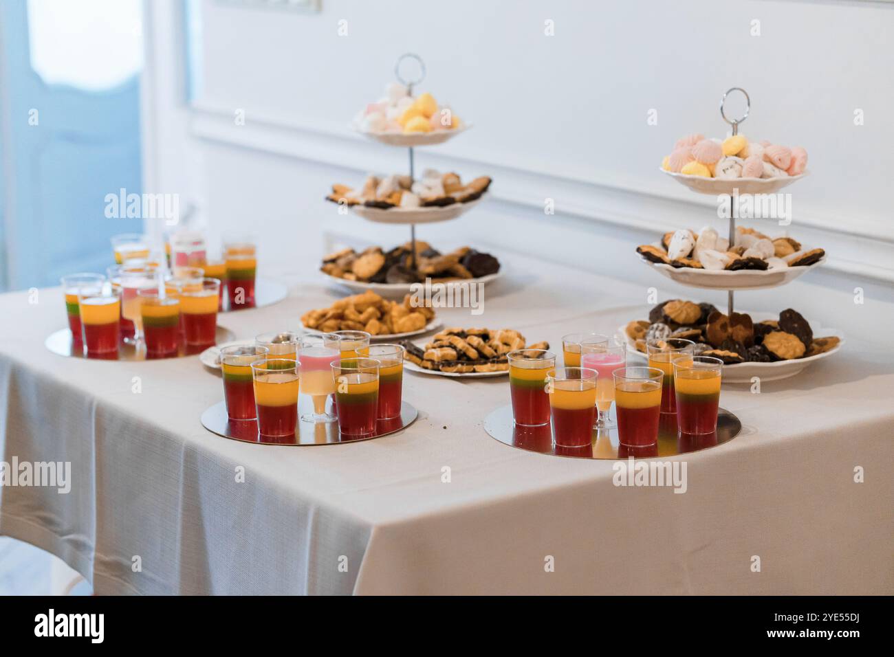 Exquisite Dessert Table Display with Colorful Beverages and Assorted ...