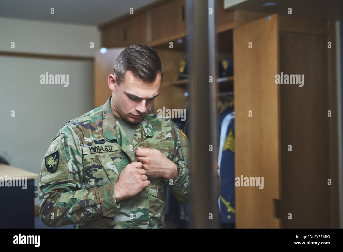 Dressing room, man and solder at military academy with training for ...