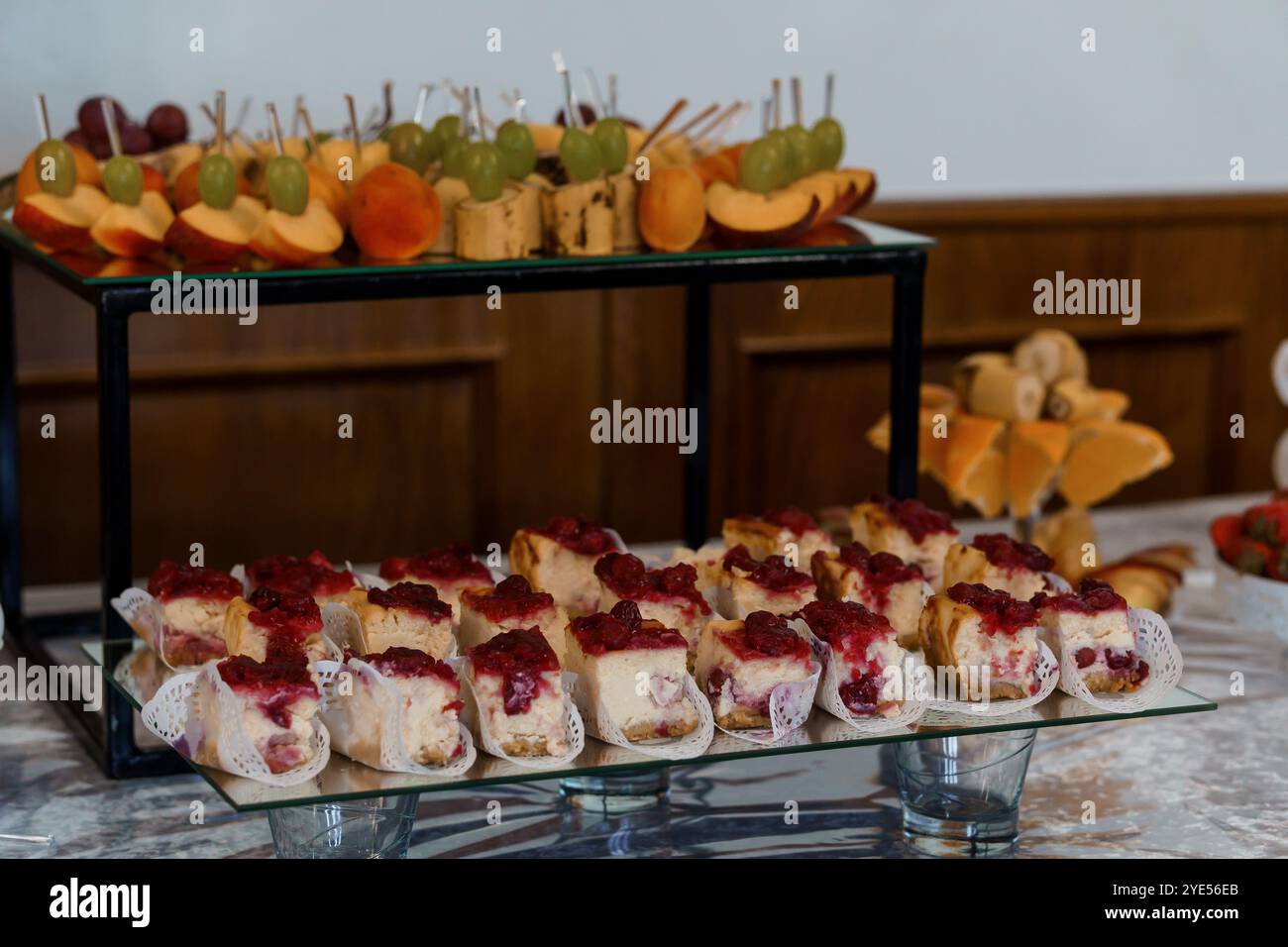 Elegant Display of Assorted Pastries and Fresh Fruits at a Buffet Stock Photo - Alamy