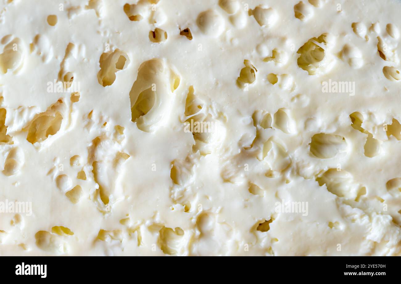 Background full-frame with the details on a chunk of sheep cheese Stock ...