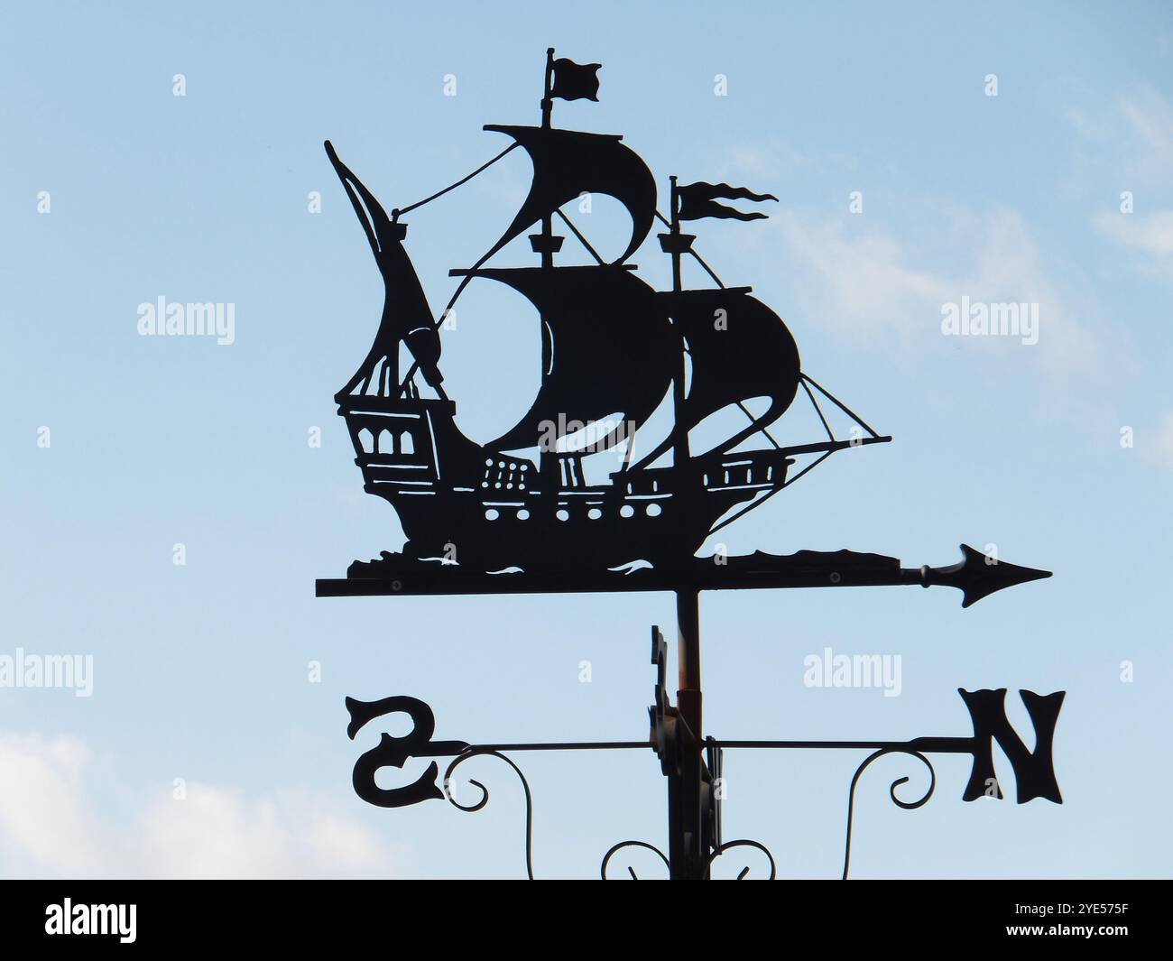 Weather vane in the shape of a sailing ship, made from steel plate. On ...