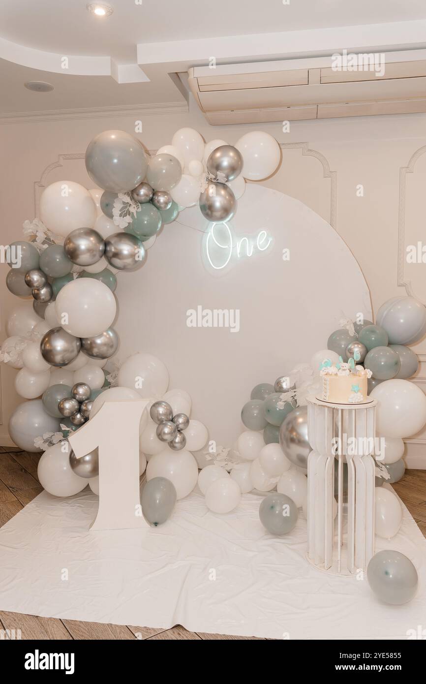Elegant Balloons and Cake Setup for First Birthday Celebration Stock ...