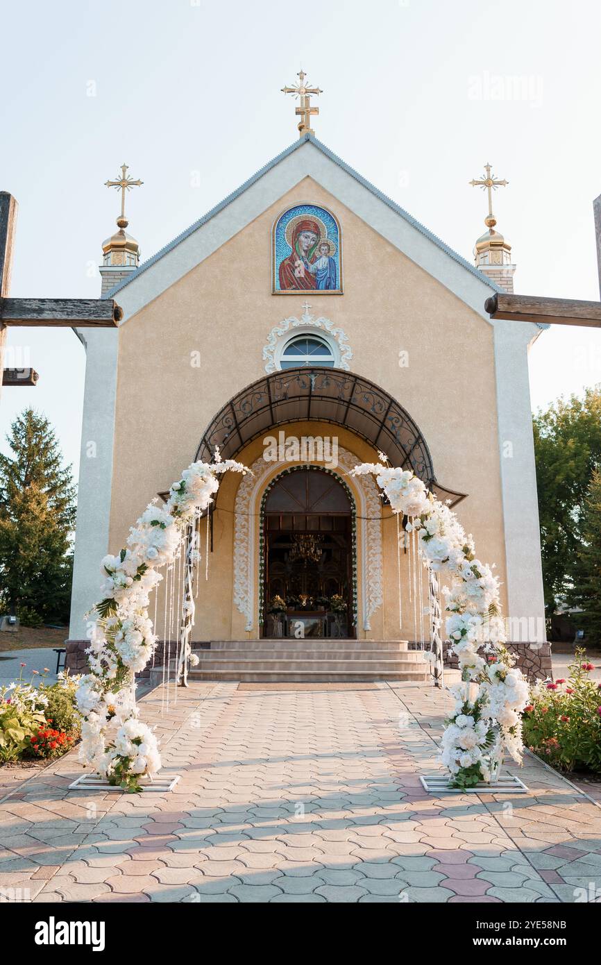 Wedding Arch at a Charming Church with Floral Decorations Stock Photo ...