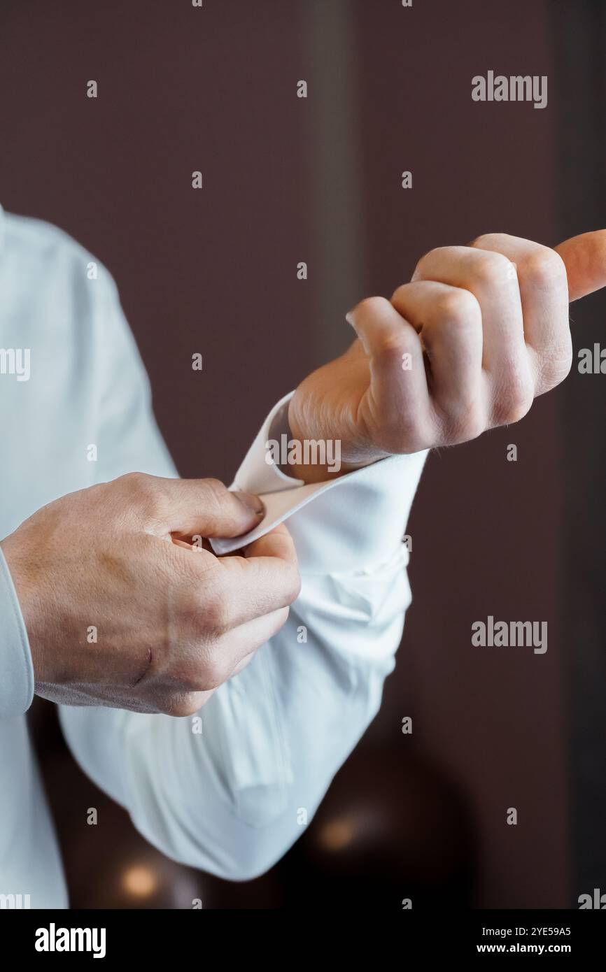 Cuff adjustment hi-res stock photography and images - Alamy