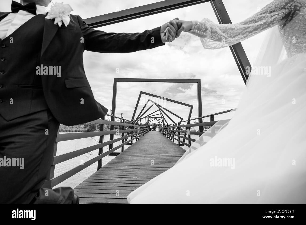 Romantic Black and White Wedding Moment on Scenic Geometric Bridge ...