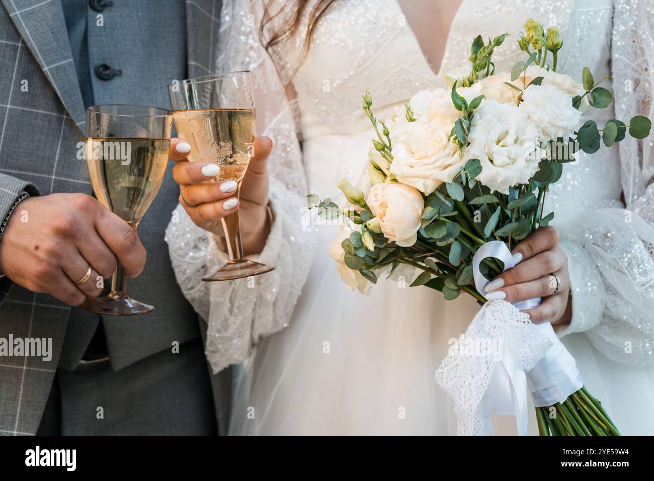 Elegant Wedding Toast with Champagne and Bridal Bouquet Stock Photo - Alamy
