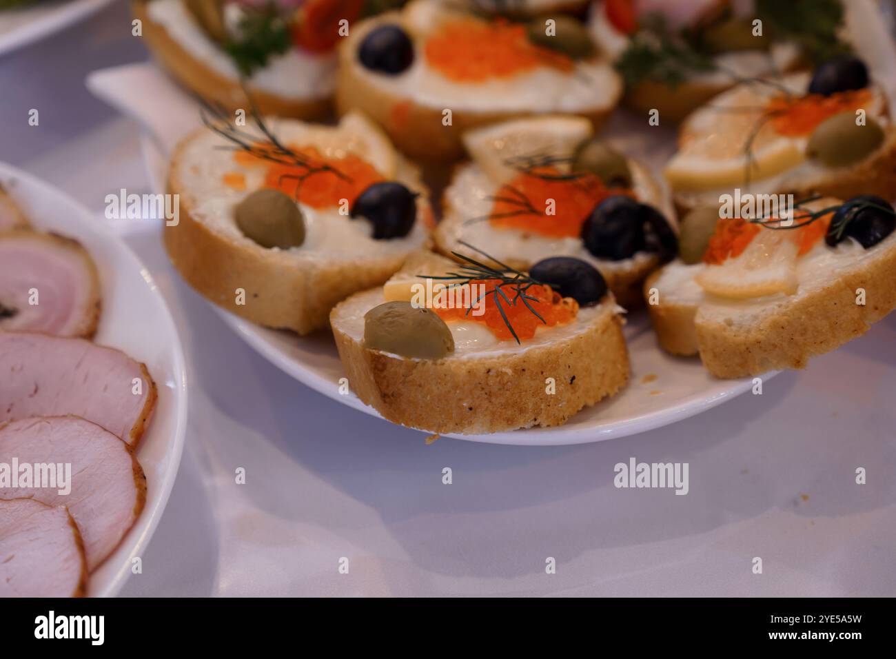 Gourmet Canapes with Cream Cheese, Caviar, and Garnishes Stock Photo ...
