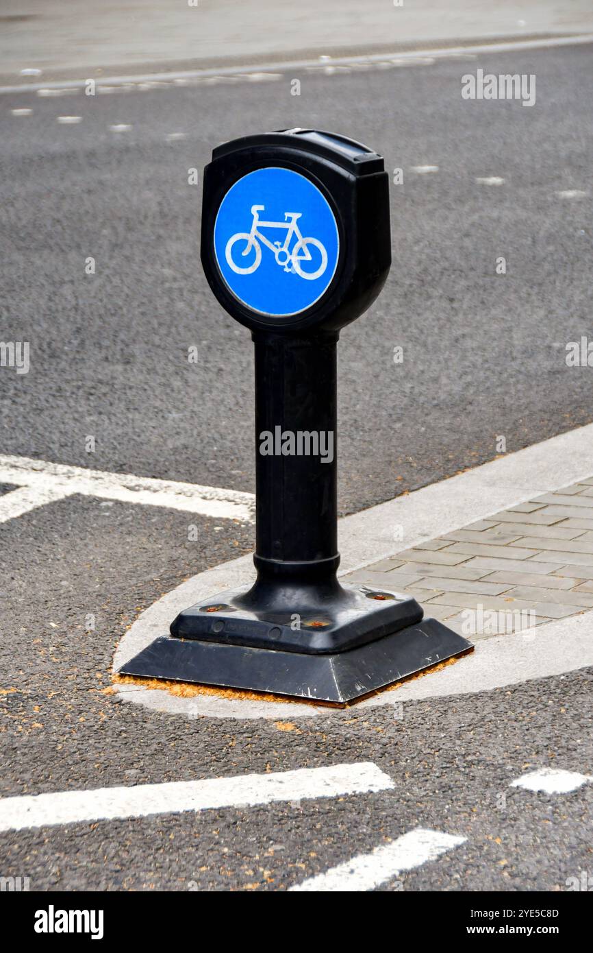 Single bollard with sign and symbol marking a cycle lane on a city ...