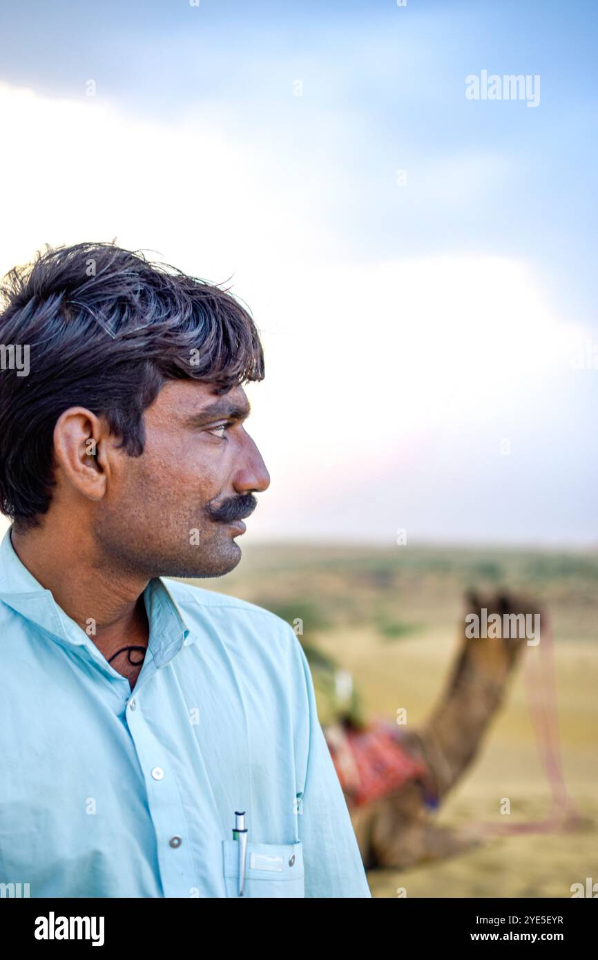 Rajasthan Male model with mustache, desert background and camel looking ...