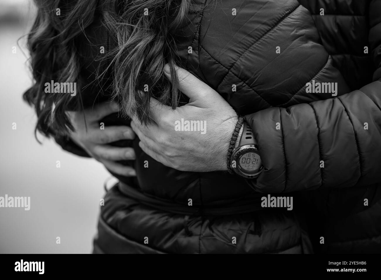 Intimate Embrace Between Two People in a Black and White Setting Stock ...
