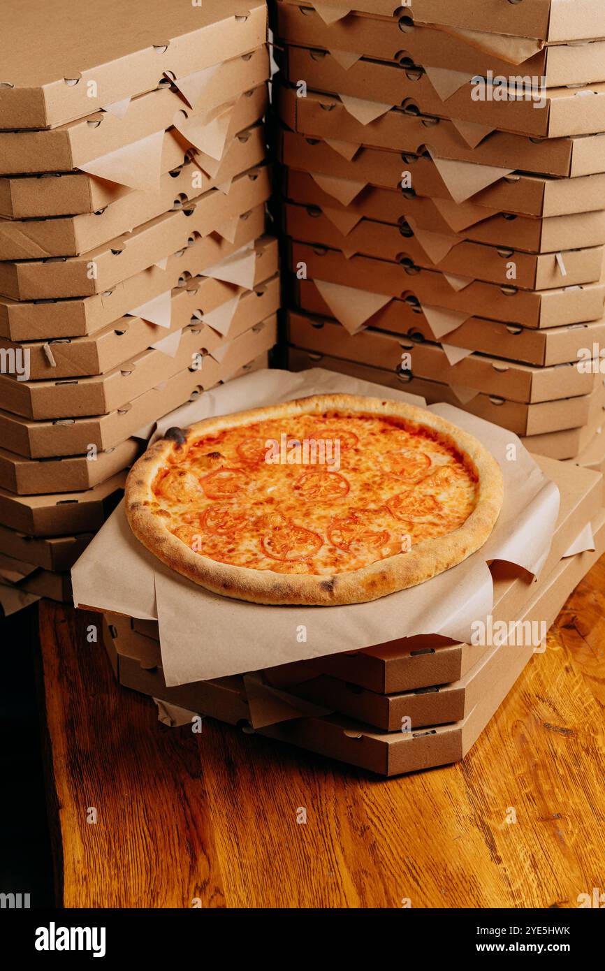Stacked pizza boxes with a fresh pizza, ready for delivery or takeaway ...