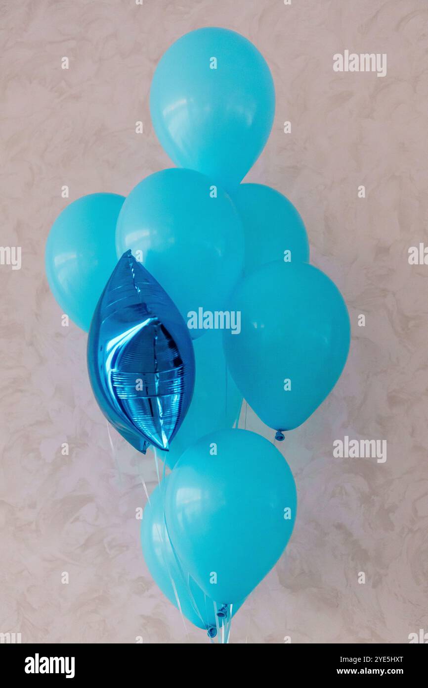 Festive Arrangement of Light Blue Balloons with a Shiny Blue Foil ...