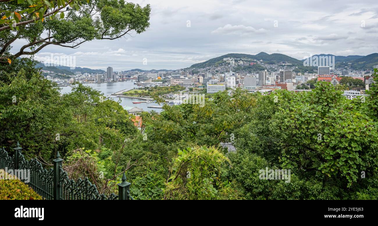 Panoramic cityscape of Nagasaki and its harbour area in Nagasaki, Japan ...