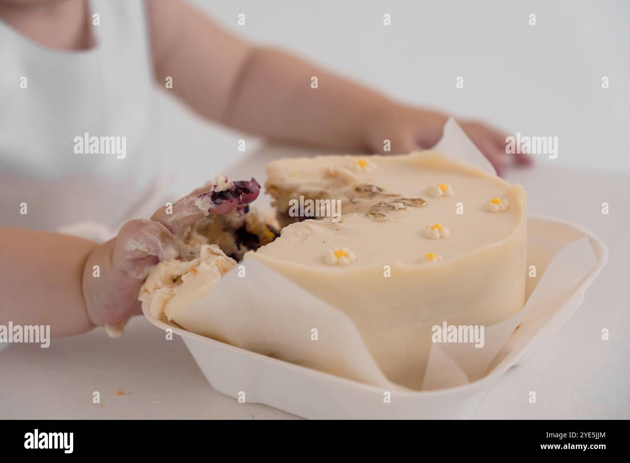 Adorable Baby Hand Reaching for a Deliciously Messy Birthday Cake Stock ...
