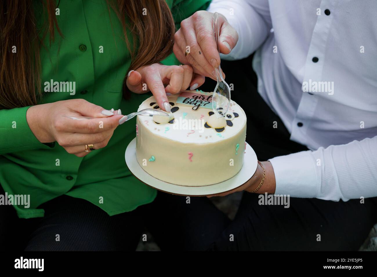 Celebration of Togetherness: Enjoying a Playful Cake Cutting Moment ...