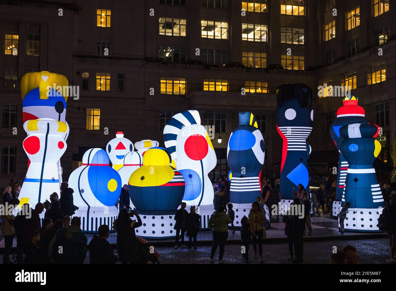People exploring the Checkmate light installation at River of Light in ...