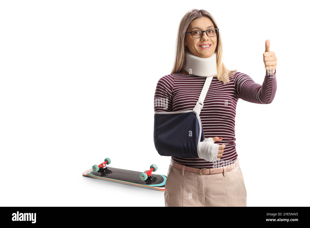 Young injured woman from a skateboard fall with arm sling and cervical ...
