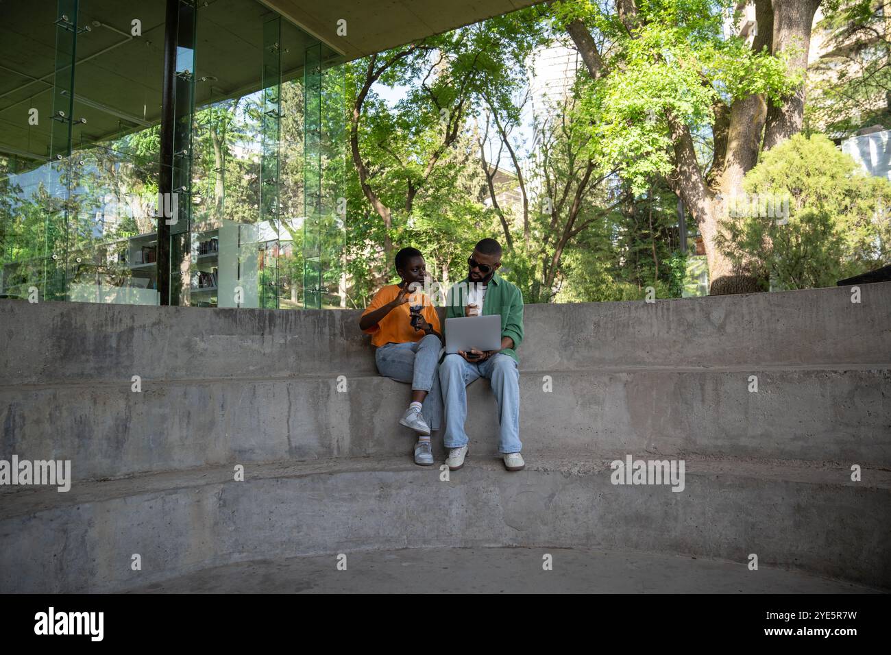 Thoughtful boyfriend, girlfriend classmates using computer to study ...