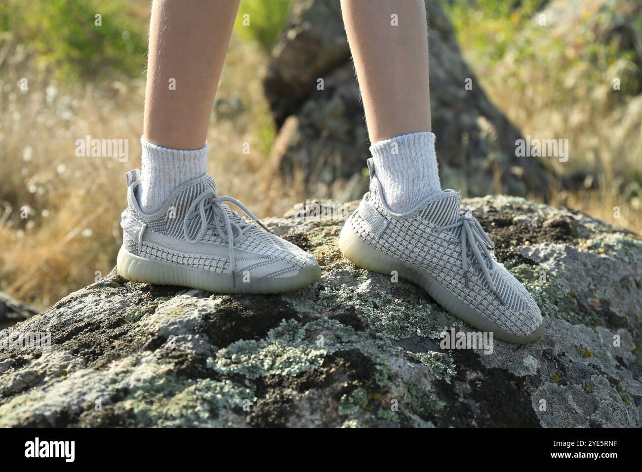 Little girl walking on stones outdoors, closeup Stock Photo - Alamy