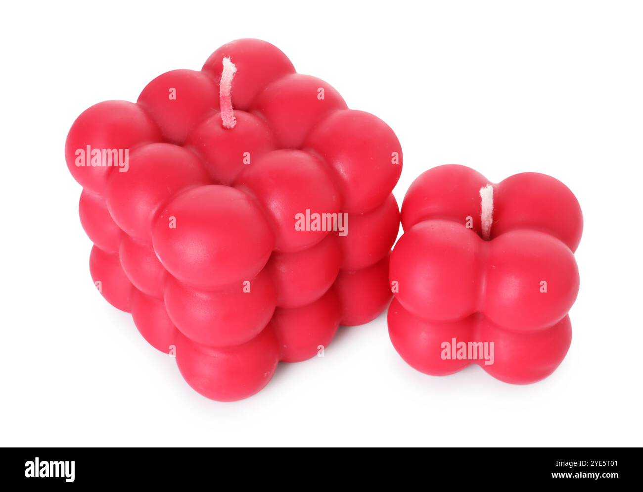 Two red bubble candles isolated on white Stock Photo - Alamy