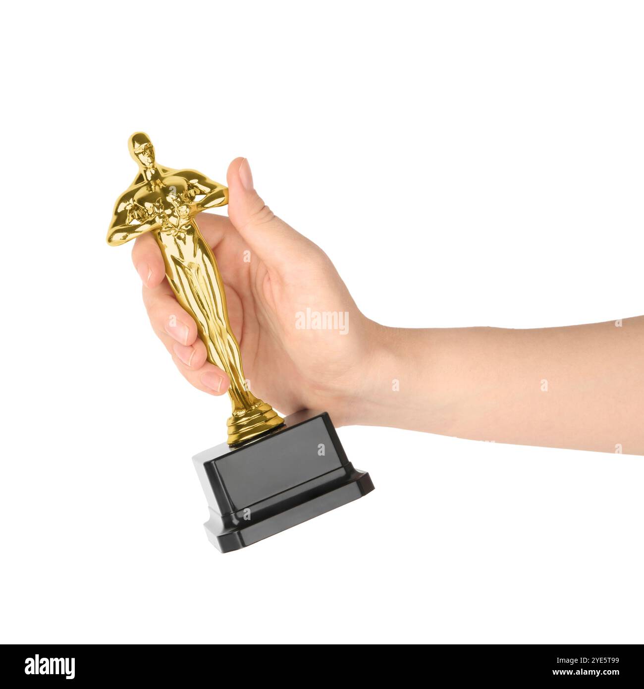 Woman holding golden trophy in shape of human figure against white ...