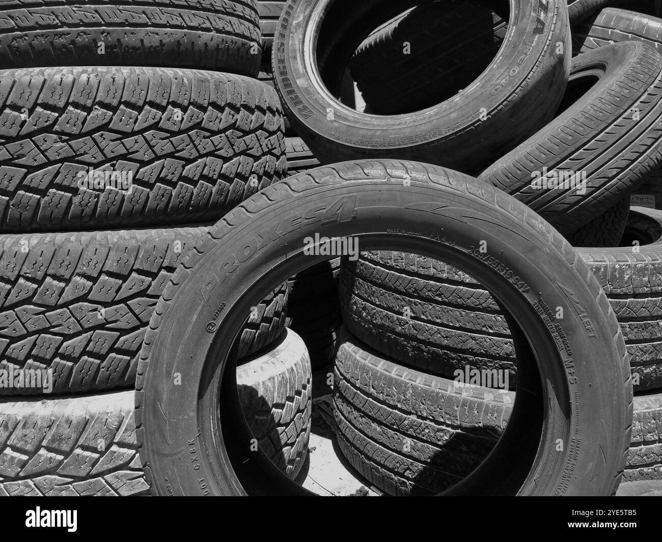 A stack of used tires in various sizes and conditions Stock Photo - Alamy