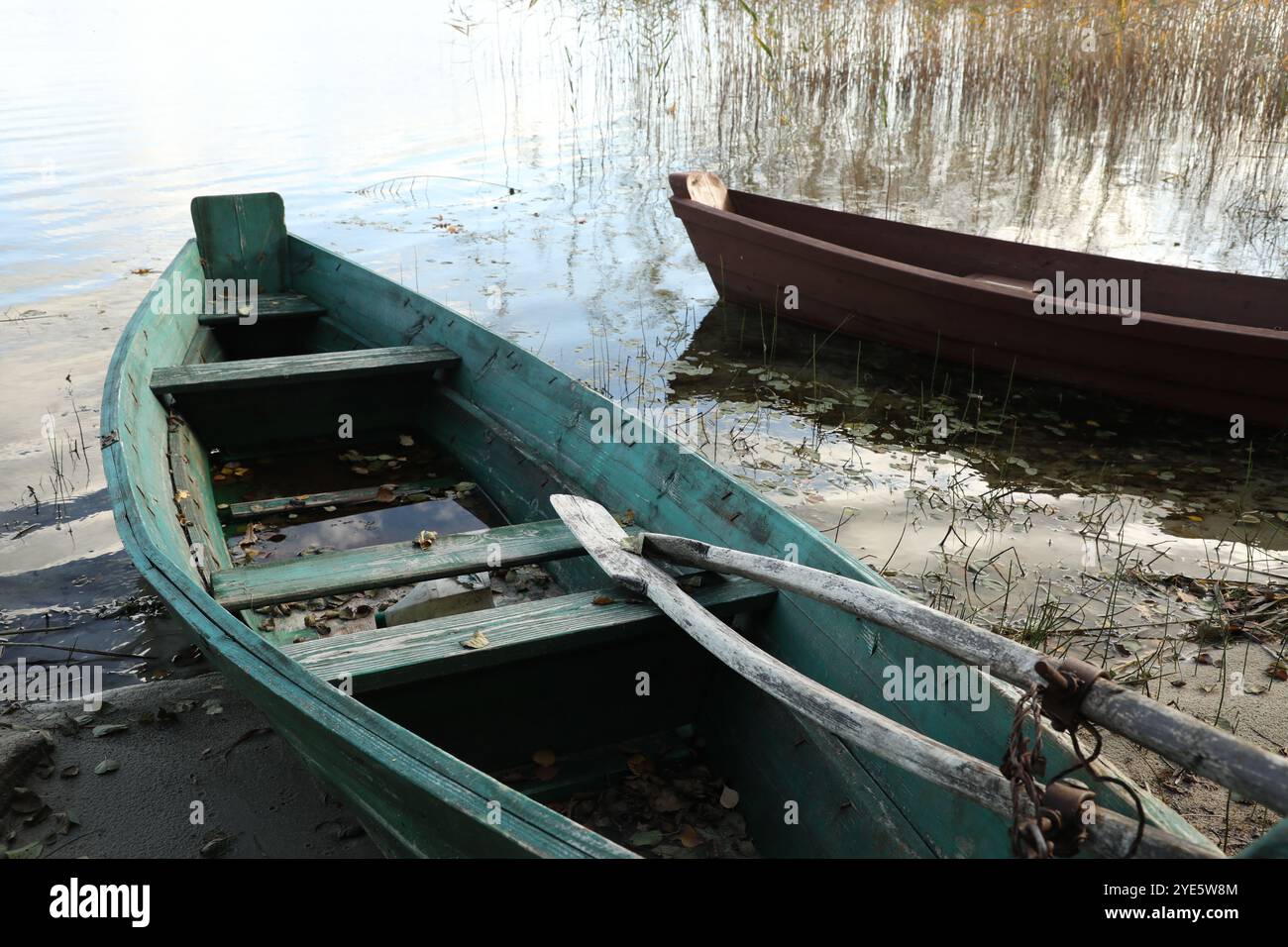Empty old fishing boats floating hi-res stock photography and images ...