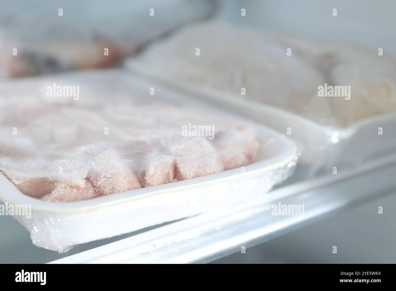 Different frozen meat products on refrigerator shelf, closeup Stock ...