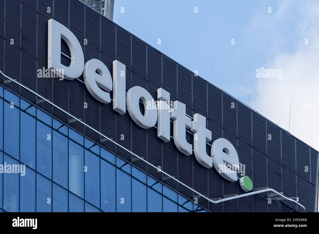The Deloitte logo is being seen on a building in Warsaw Stock Photo - Alamy