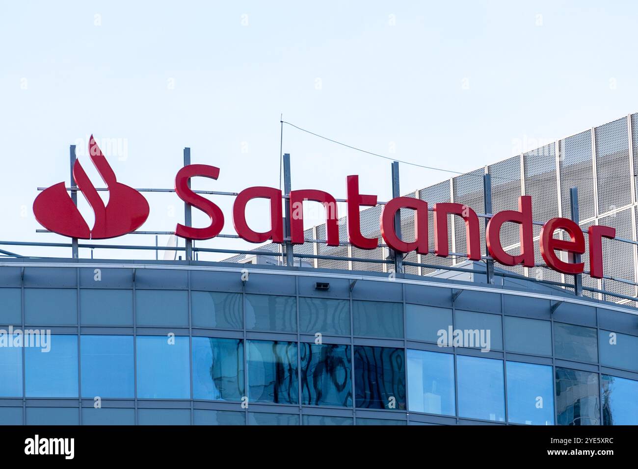 The Santander logo is being seen on a building in Warsaw Stock Photo ...
