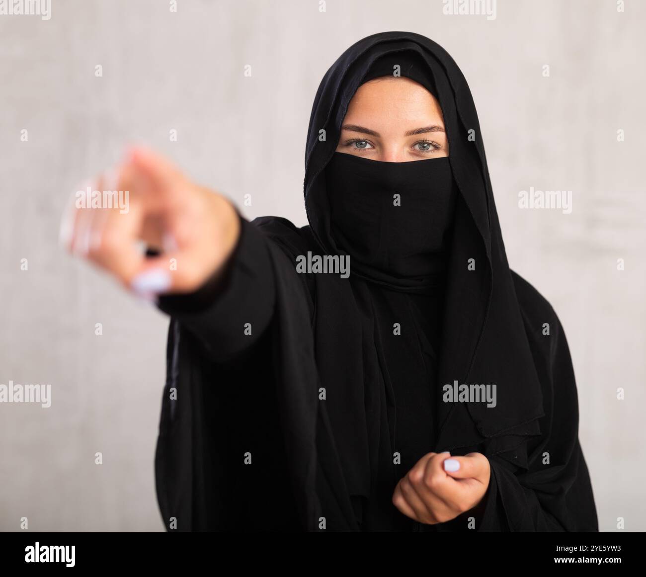 woman with her face covered by burka points her hand to side Stock ...