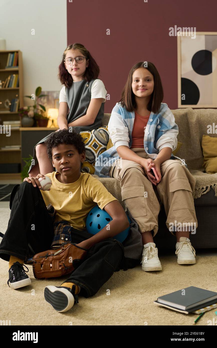 Group of friends relaxing in cozy living room with contemporary decor ...