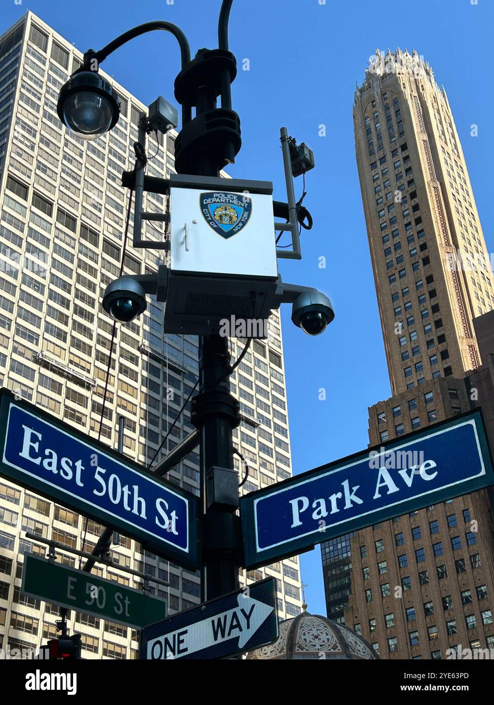 Low angle view of two office buildings with police security cameras ...