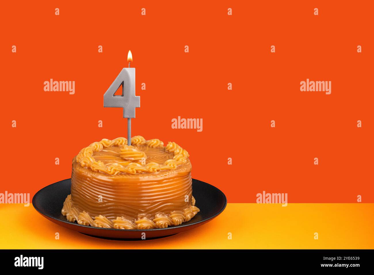 Birthday cake with dulce de leche frosting - Candle number 4 Stock ...