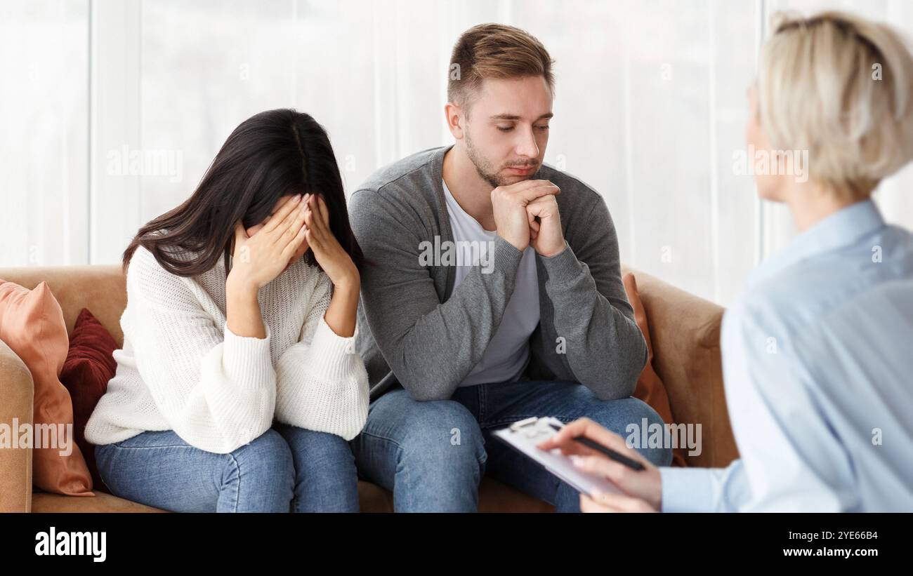 Professional Psychologist Talking With Desperate Couple Sitting In ...