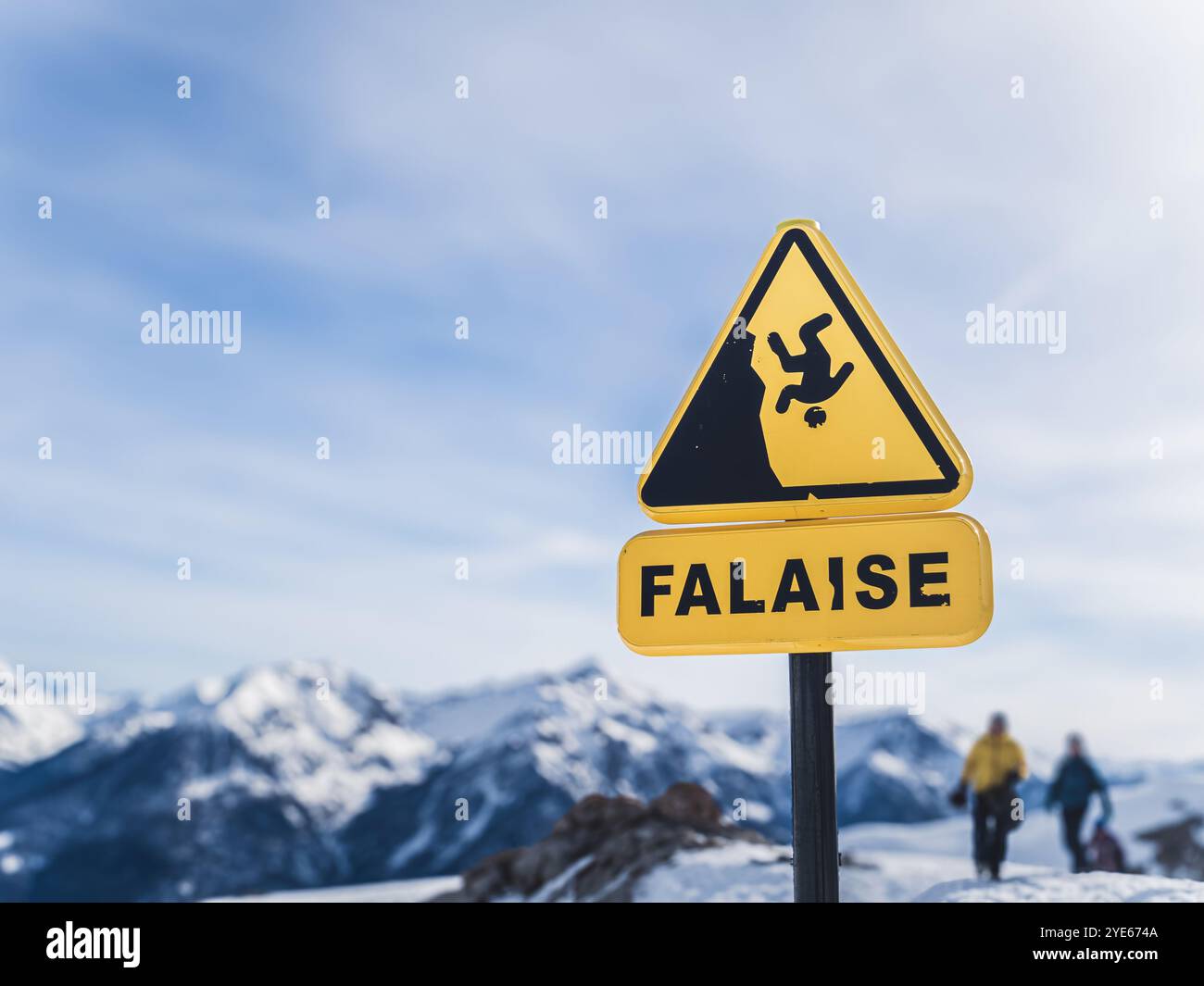 A yellow triangular cliff warning danger sign with the word "Falaise ...