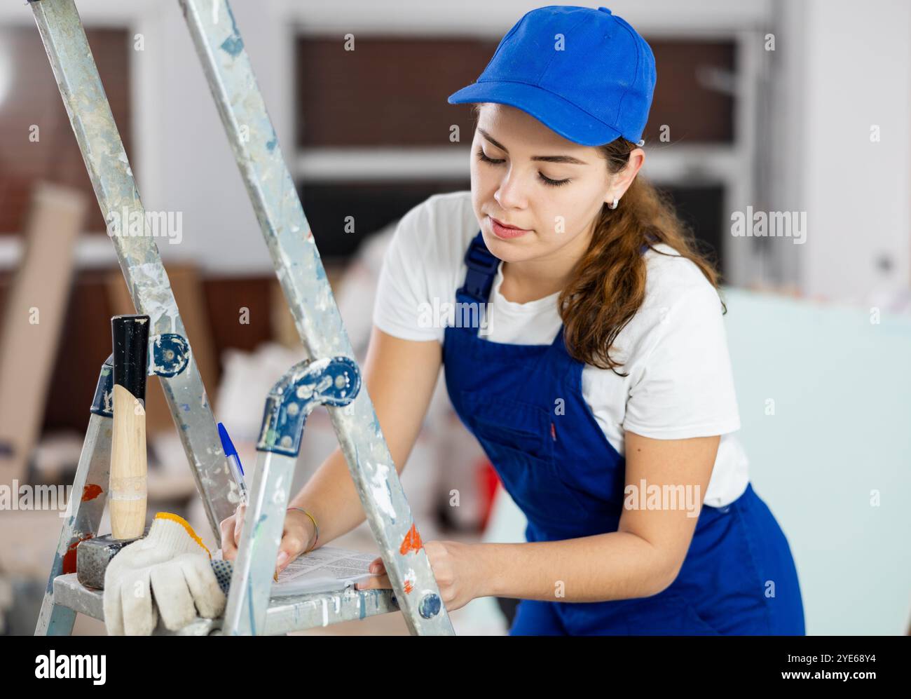 Woman foreman signs an act of acceptance of completed work Stock Photo ...