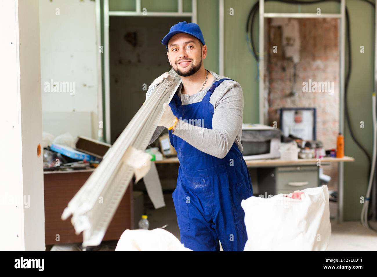 Male worker stacking materials hi-res stock photography and images - Alamy