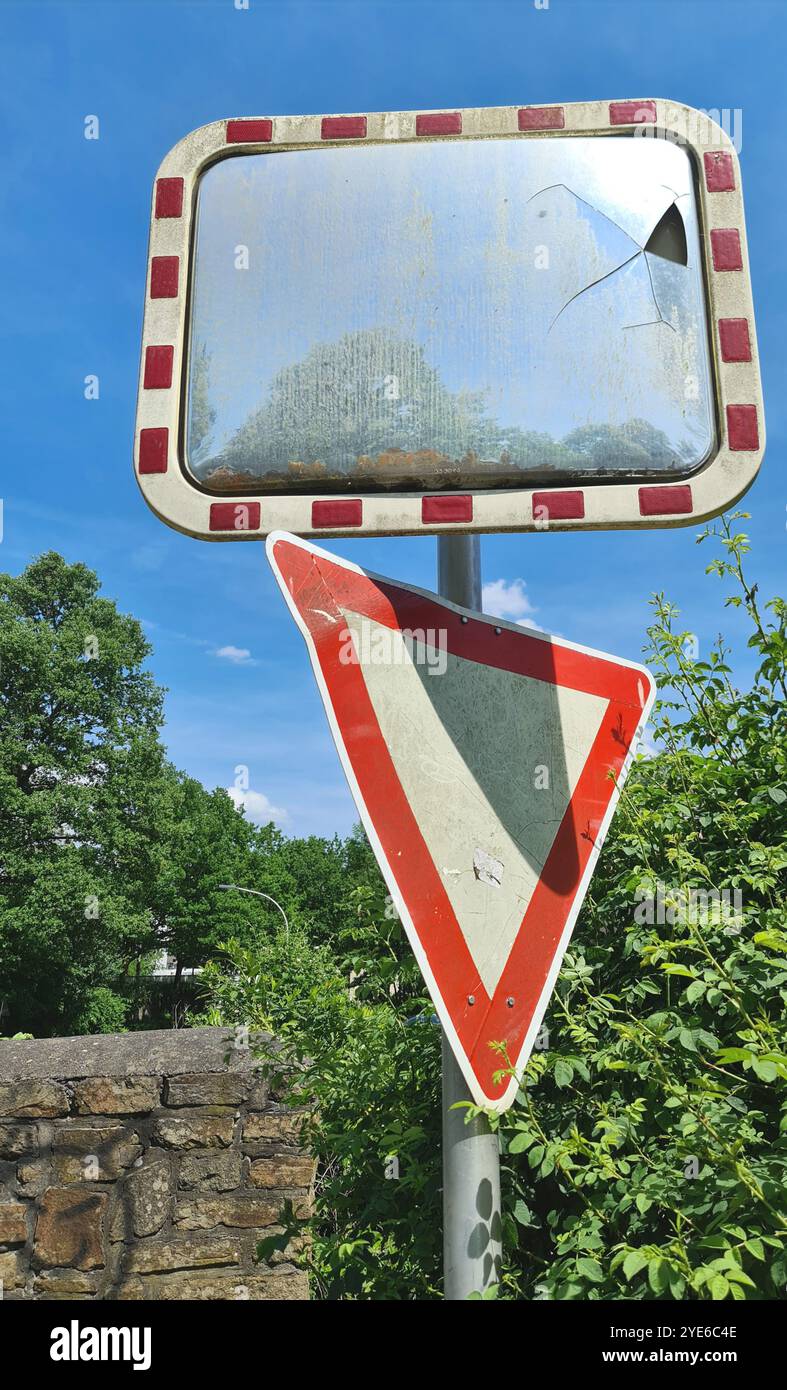 Defective traffic mirror and give way sign, Germany Stock Photo - Alamy