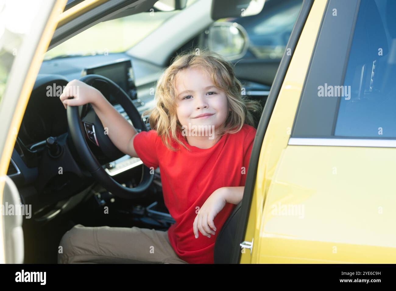 Kid Driver. Cute little boy pretending to drive. Kid in car with his ...