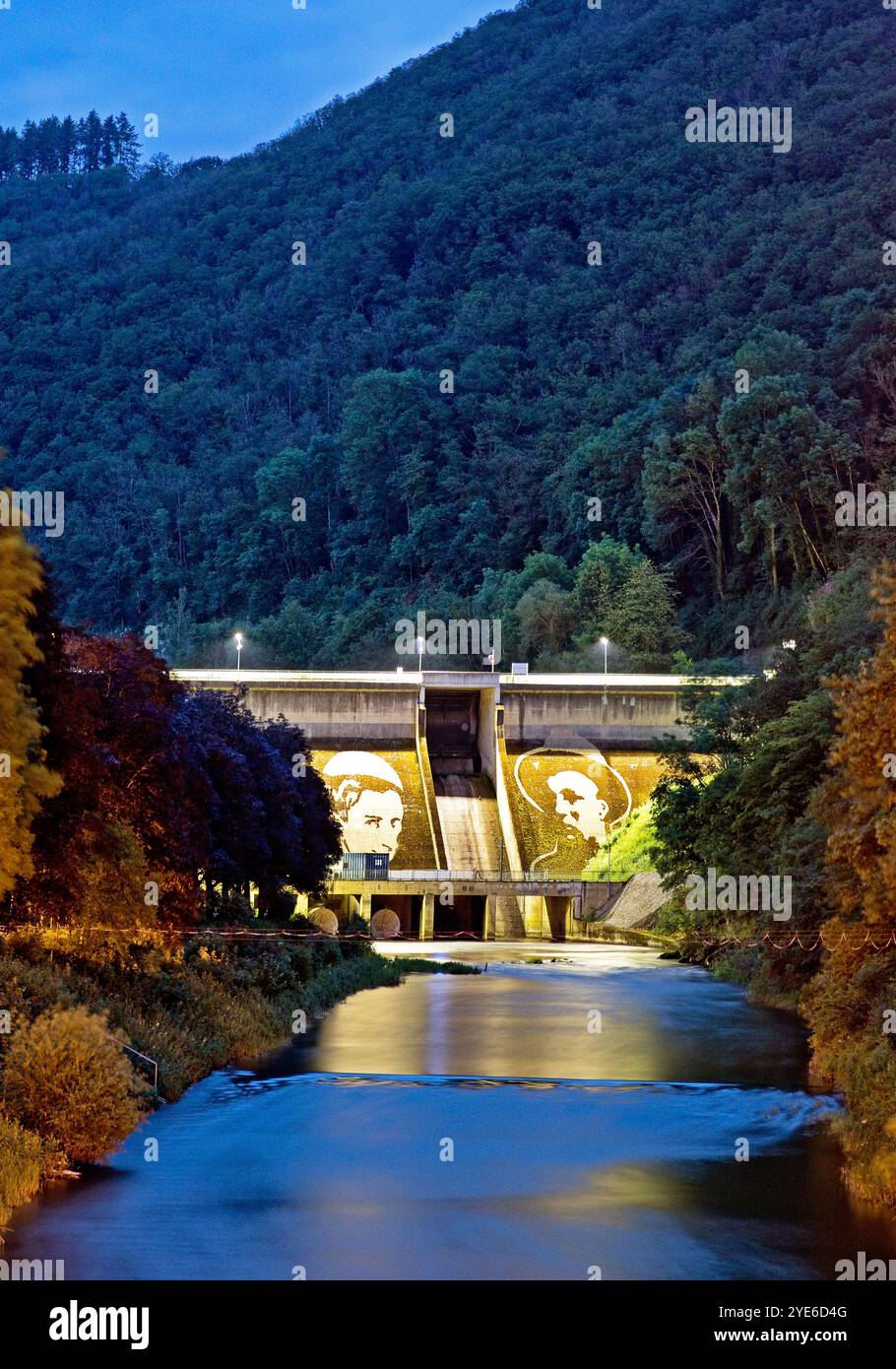 dammed river Our with art on the illuminated dam wall of the lower ...