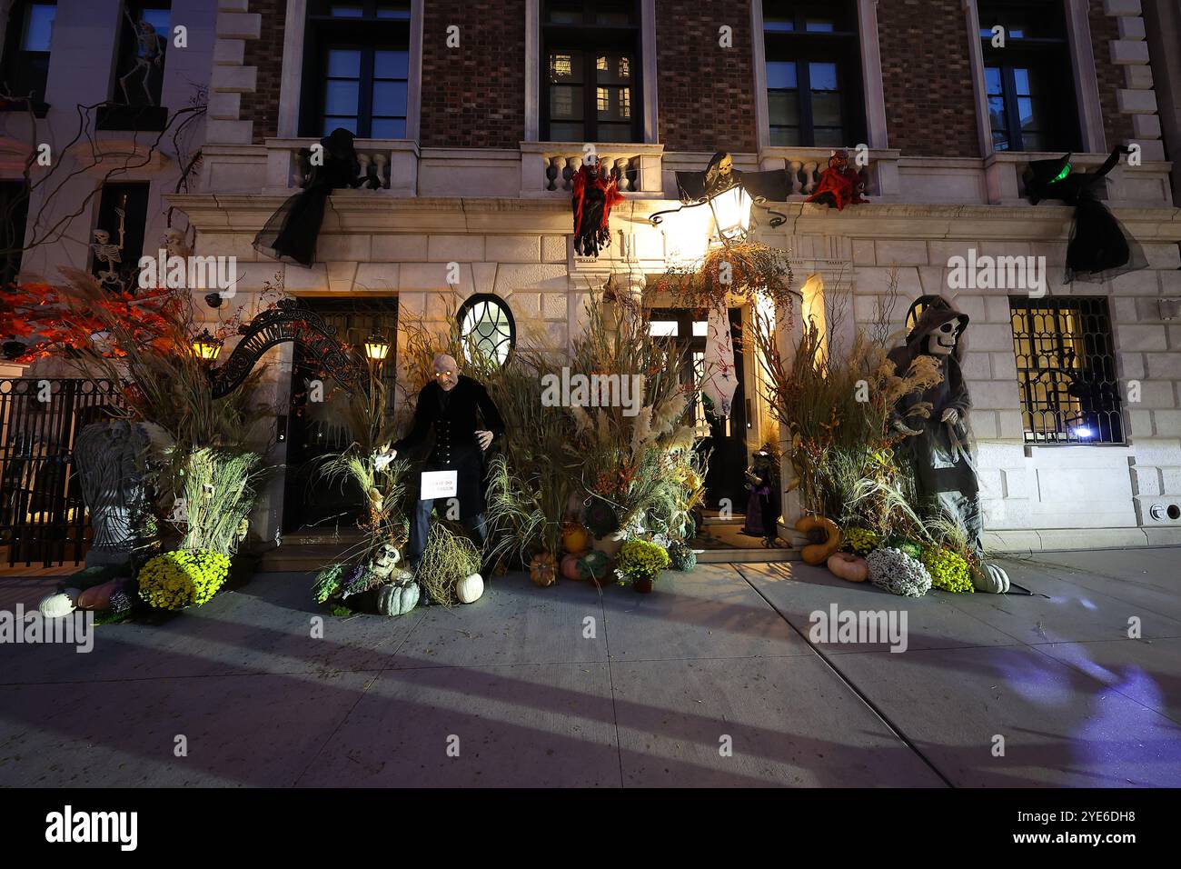 Eerie creatures, flowers and stalks of corn decorated the outside a ...