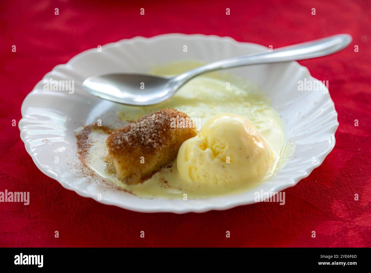 Traditional Brazilian dessert: flambéed banana with vanilla ice cream ...