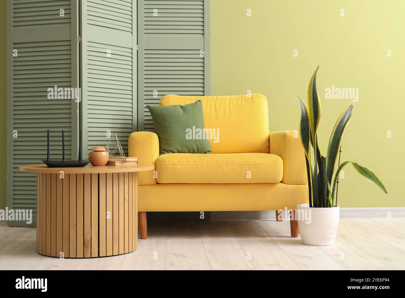 Interior of living room with armchair and wi-fi router on table Stock ...