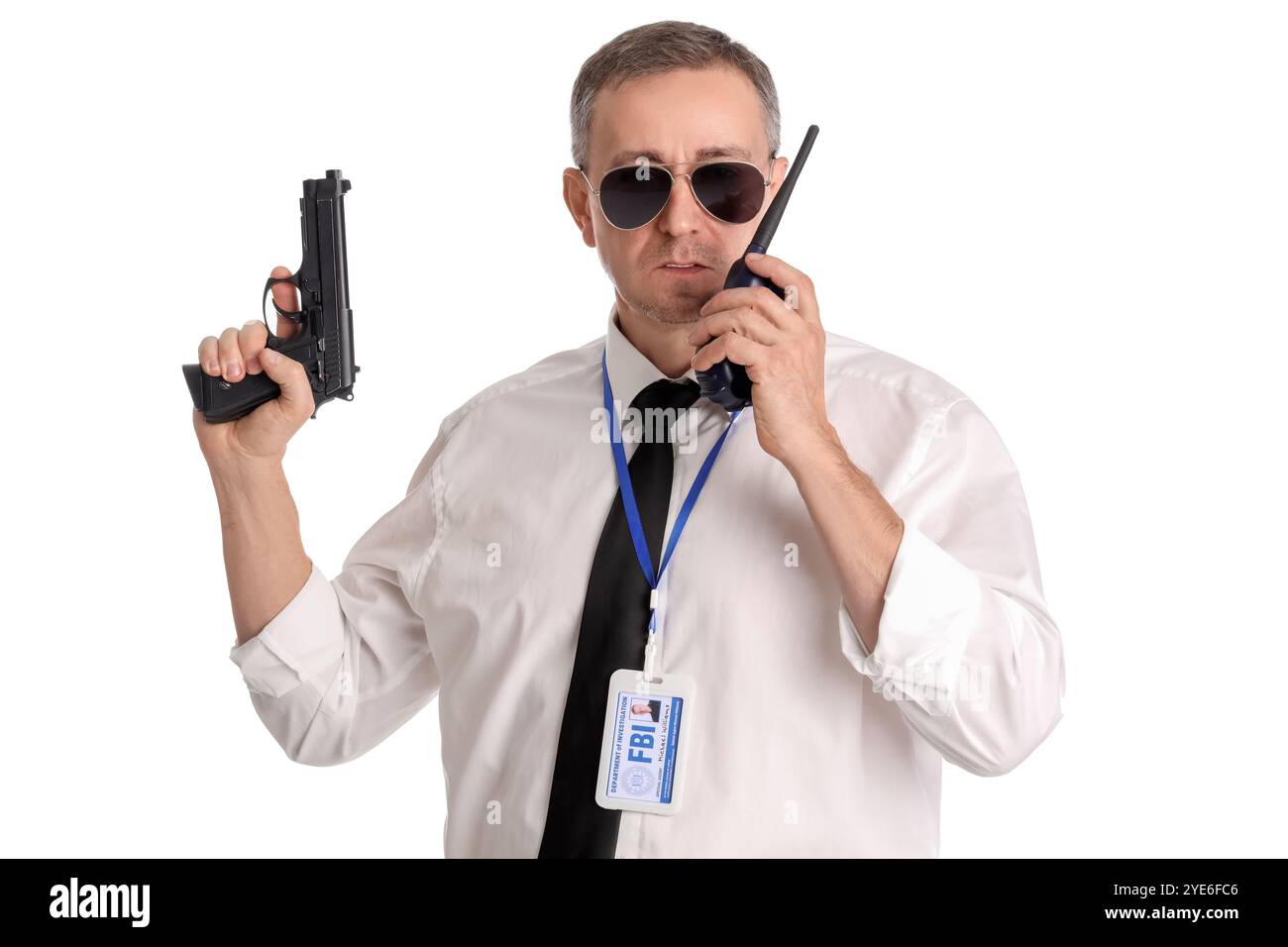 Mature FBI agent with two-way radio and gun on white background Stock ...